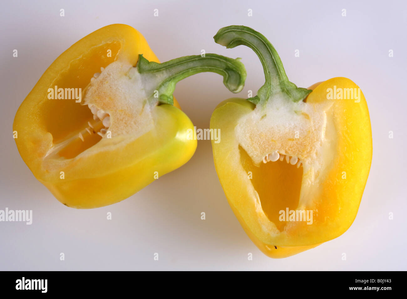 Yellow Bell Pepper Sliced in half Stock Photo - Alamy