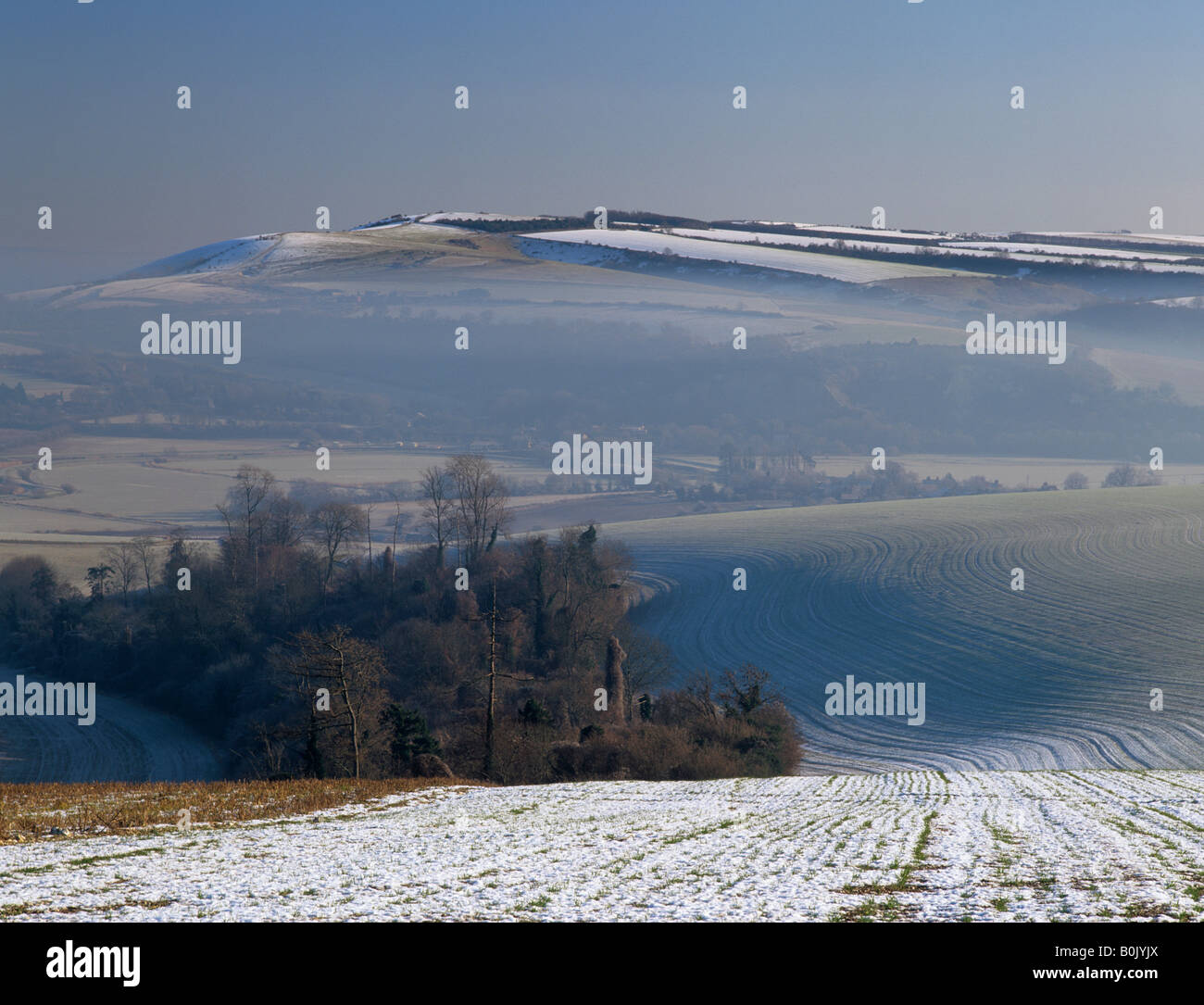MORNING MIST in the ARUN VALLEY from Bury Hill with snow on South Downs ...