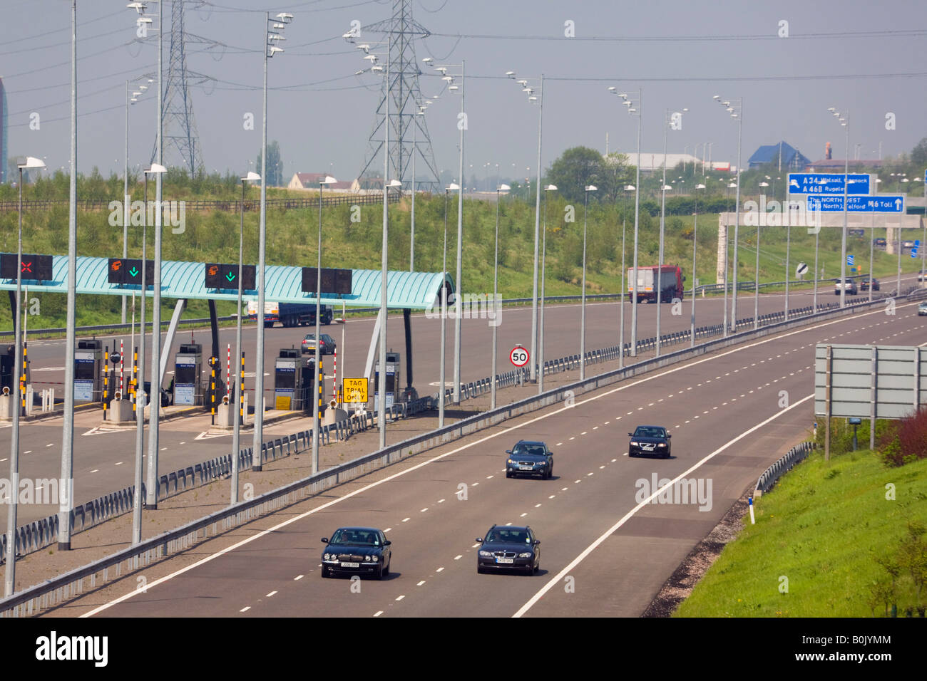 M6 TOLL MOTORWAY from above with toll booths and vehicles on ...