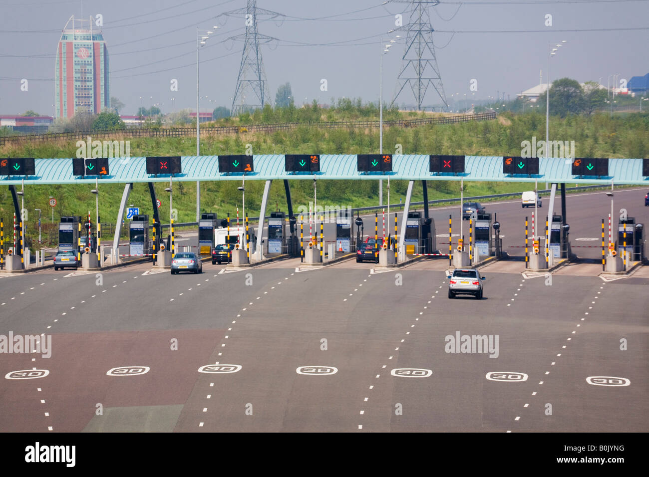 M6 TOLL MOTORWAY from above with vehicles approaching toll booths West ...