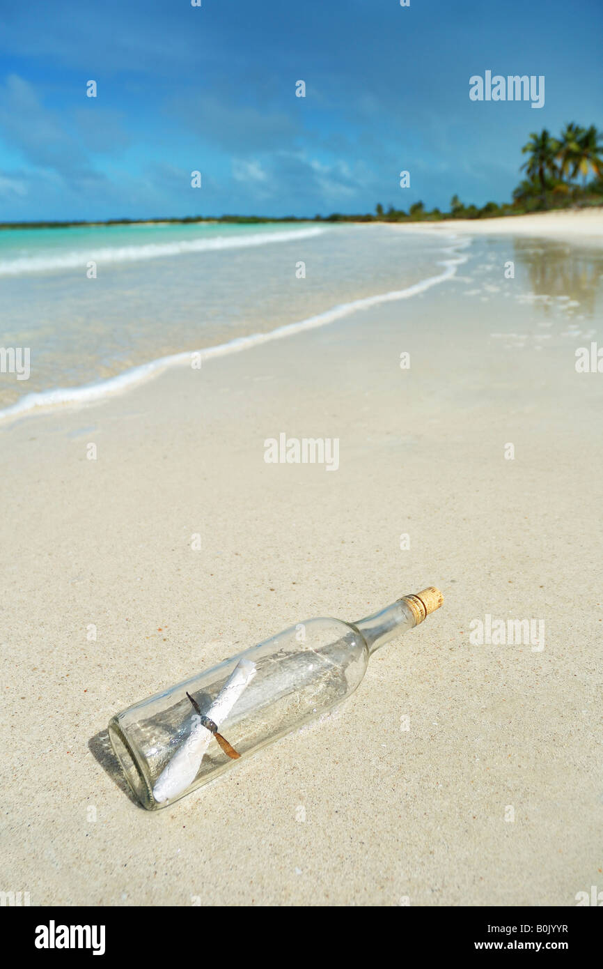 Message in a bottle on beach Stock Photo - Alamy