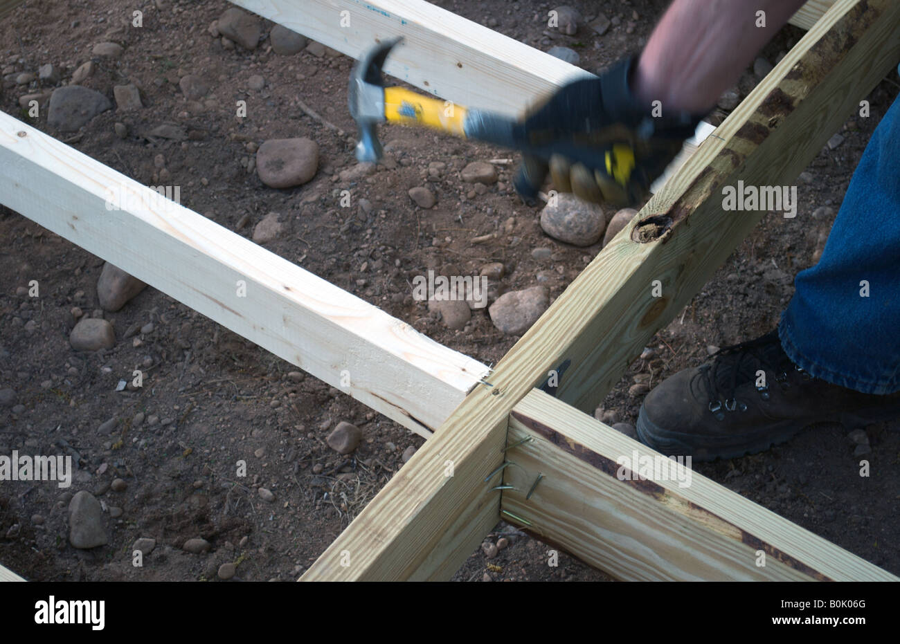 Nailing using a hand hammer Stock Photo - Alamy