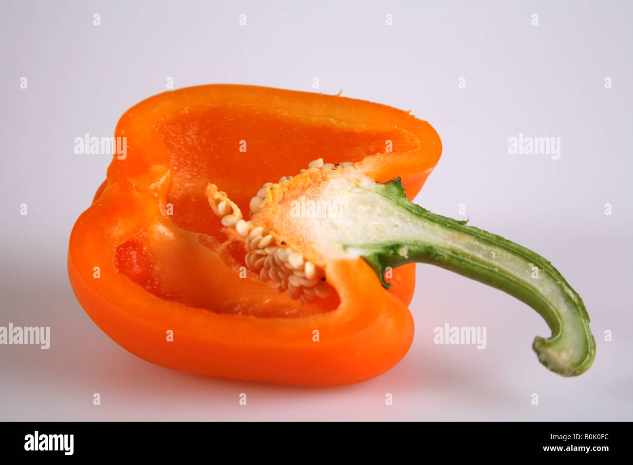 Orange Bell Pepper Sliced in half Stock Photo - Alamy