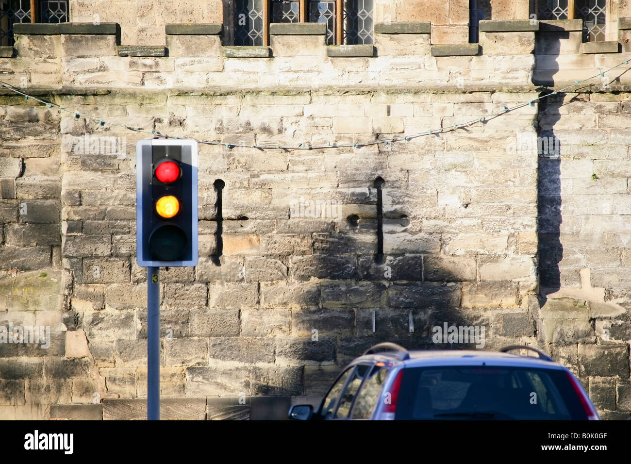 A traffic light on a road set to red and amber Stock Photo - Alamy
