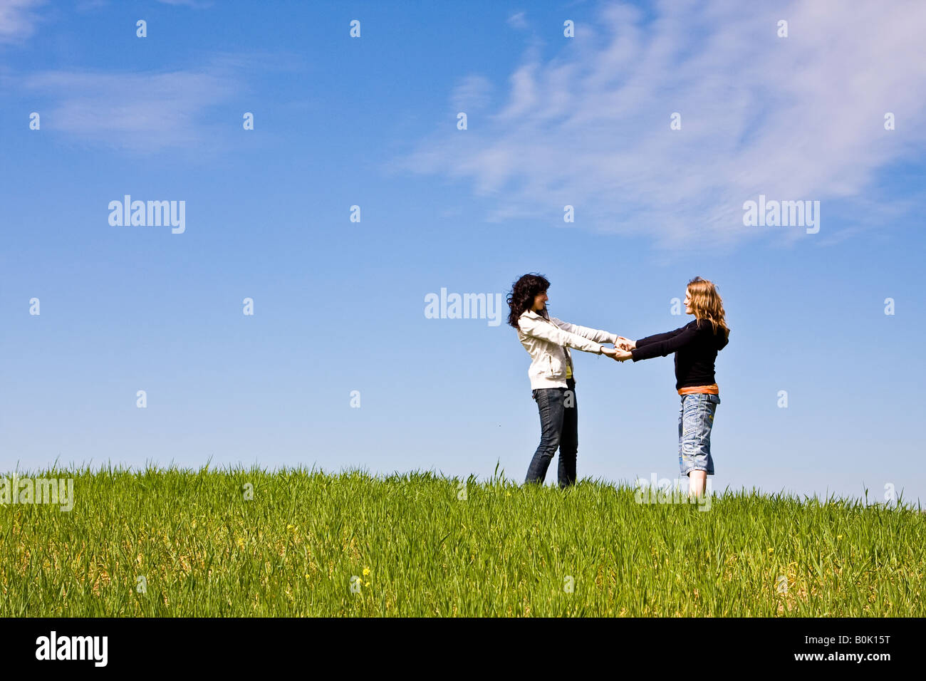 Couple of united friends on idyllic spring landscape Stock Photo - Alamy