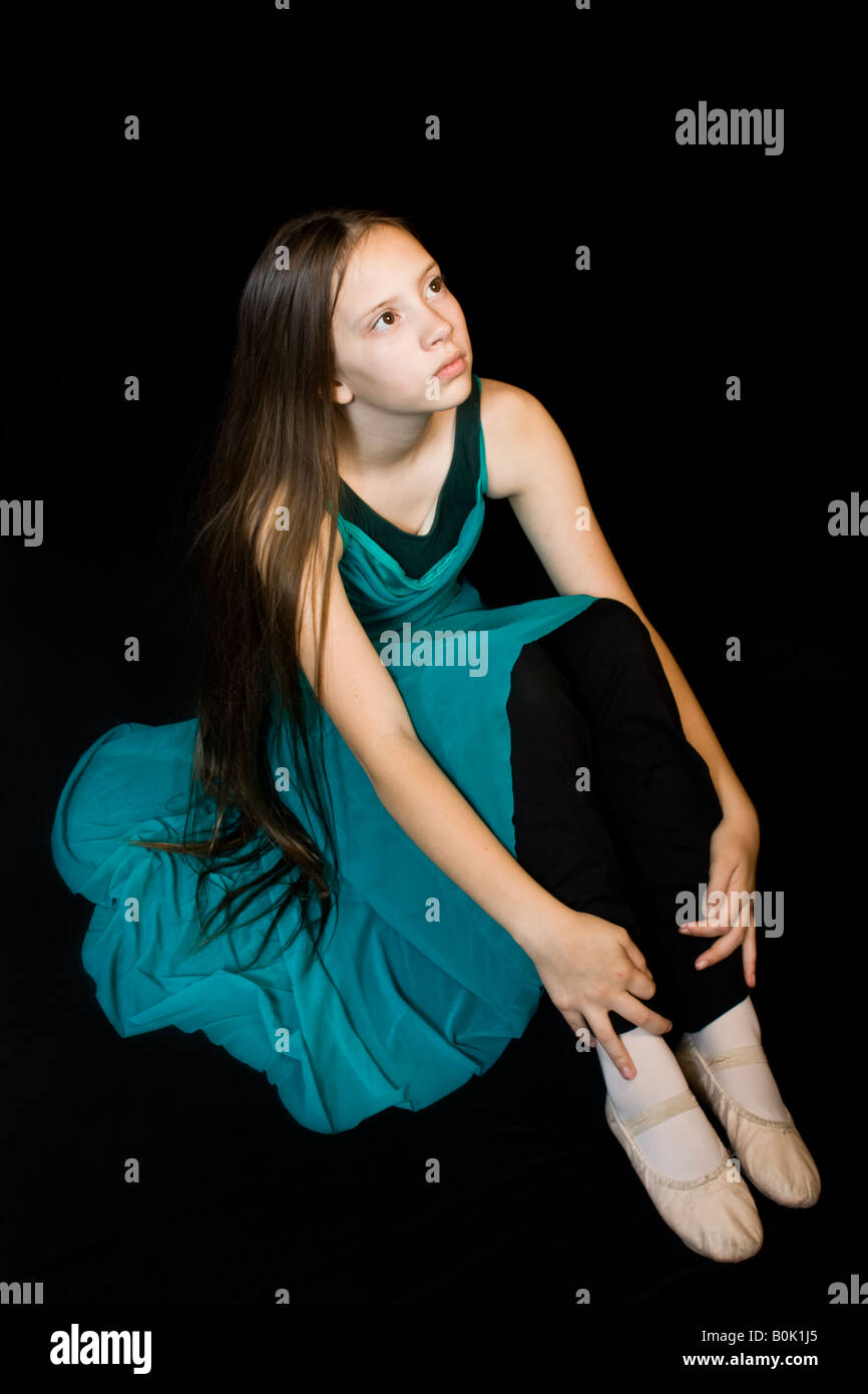 Girl in sitting ballet position Stock Photo - Alamy
