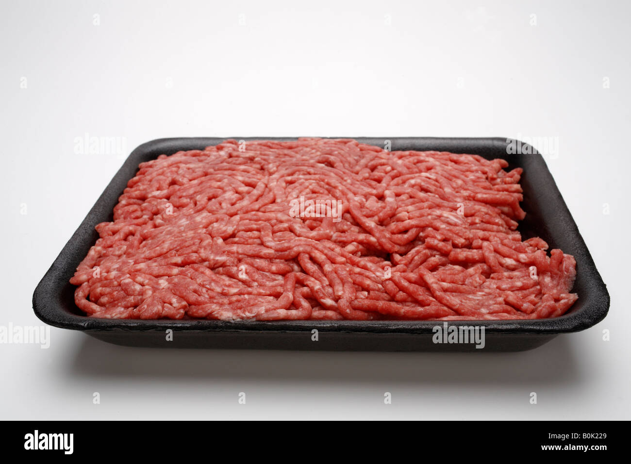 Raw ground beef in black Styrofoam container Stock Photo - Alamy