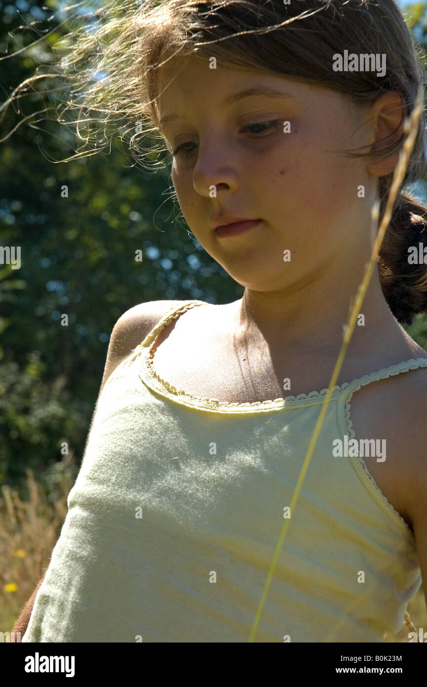 Nine year old girl portrait in a field Stock Photo - Alamy