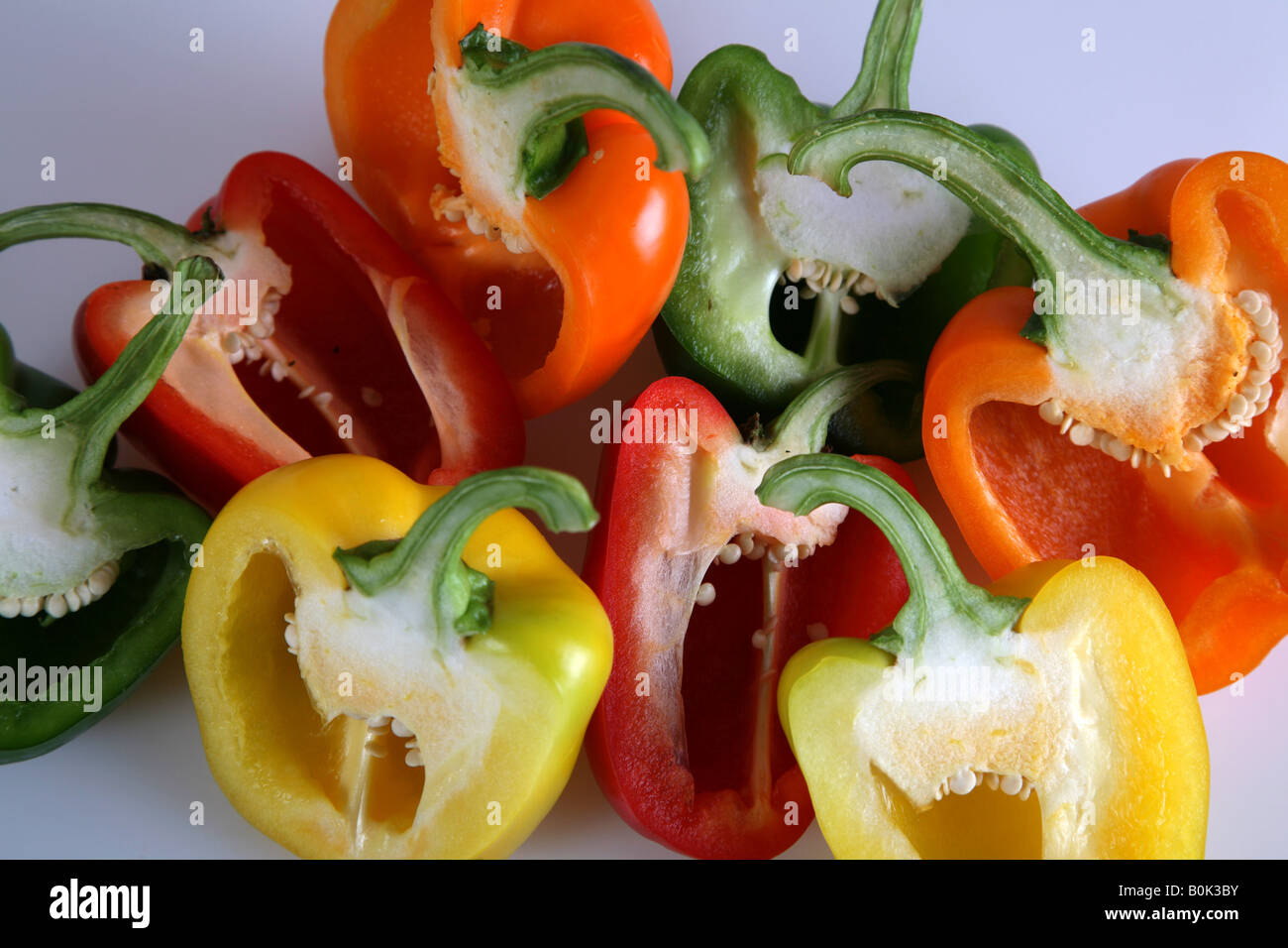 Coloured Bell Peppers Sliced in half Stock Photo - Alamy