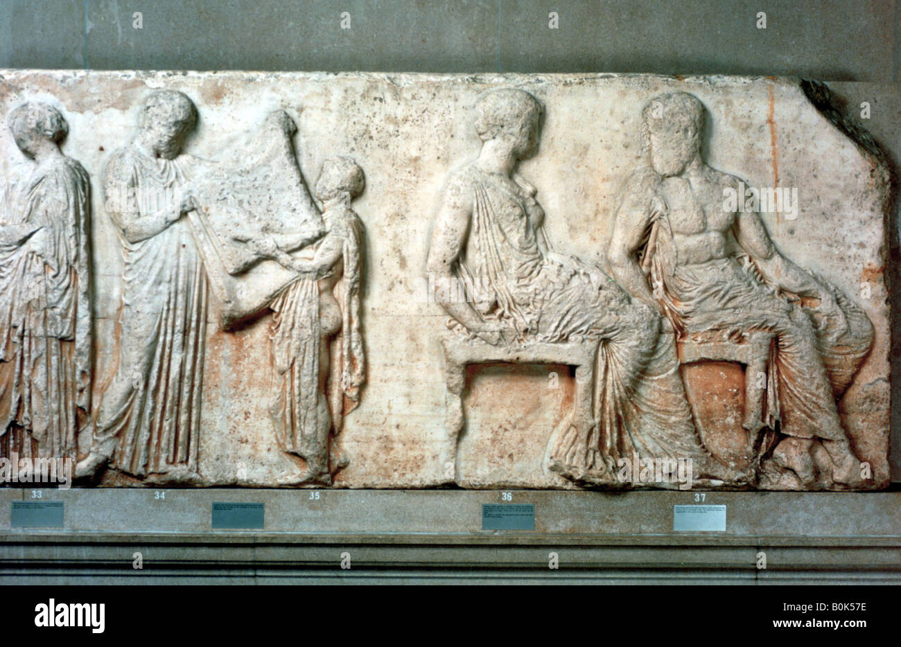 The sacred robe of Athena held up by cult officials, and Athena and ...