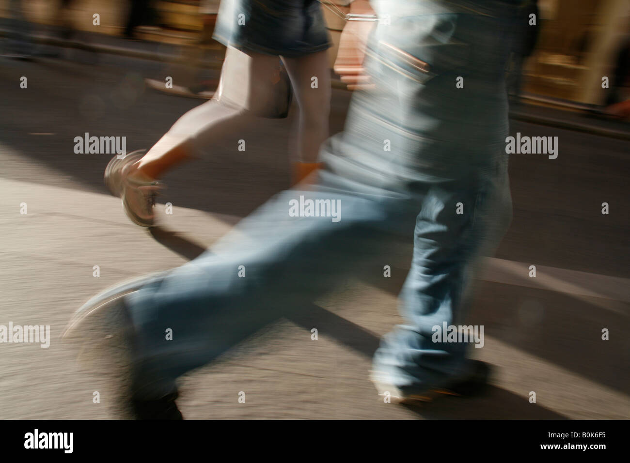 one person walking in street in city town Stock Photo - Alamy