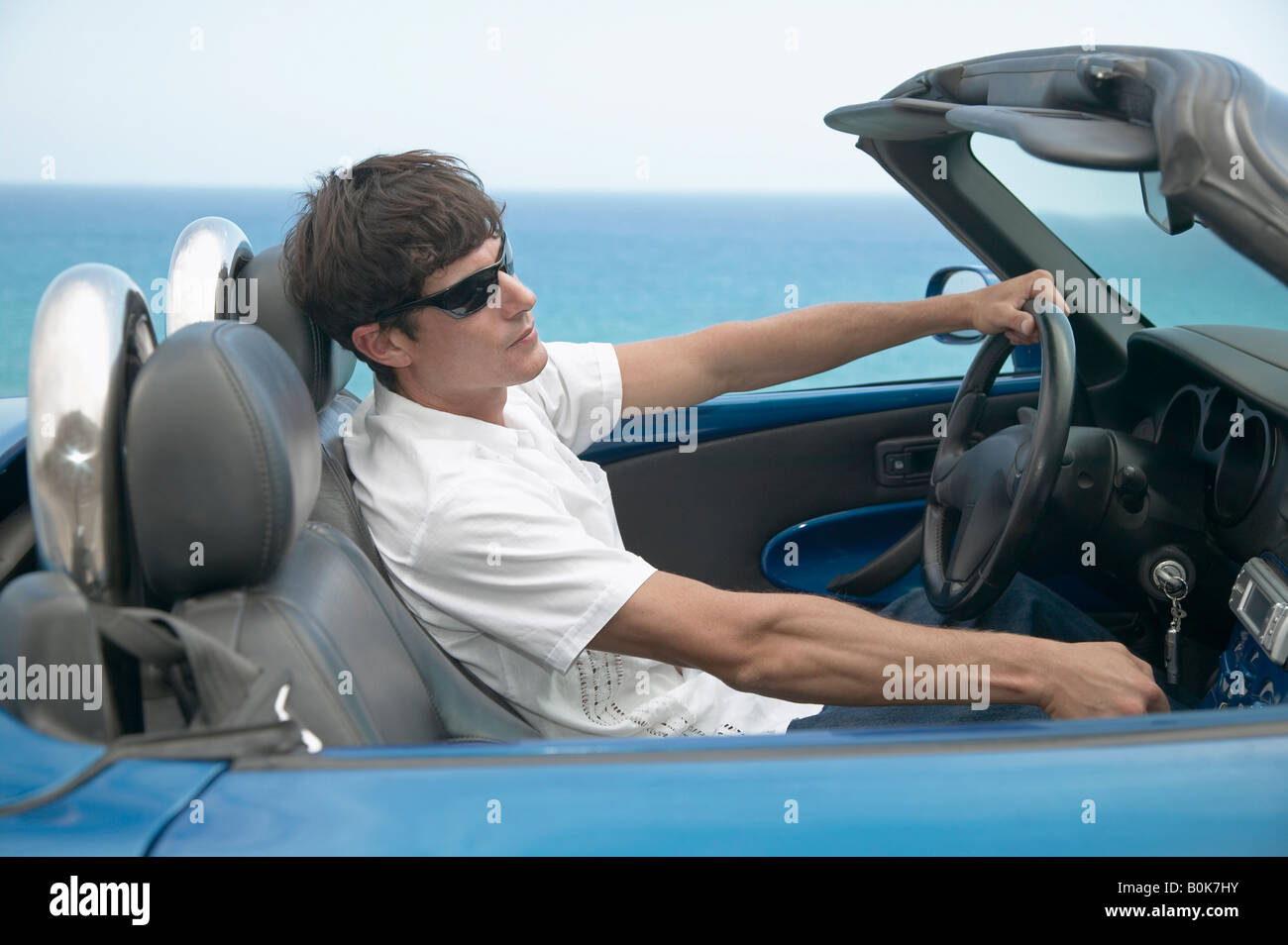 Mid-Adult Man Driving Convertible Stock Photo - Alamy