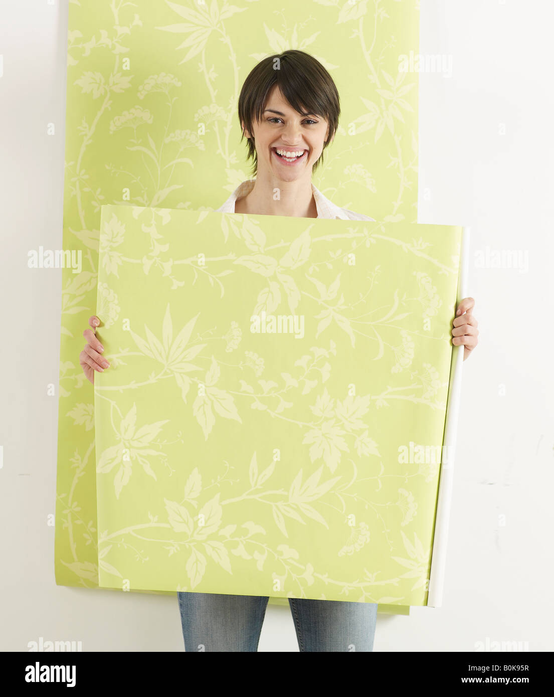 Woman wallpapering hi-res stock photography and images - Alamy