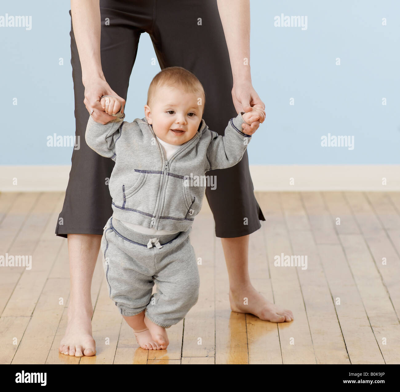 Baby Boy Learning to Walk Stock Photo - Alamy