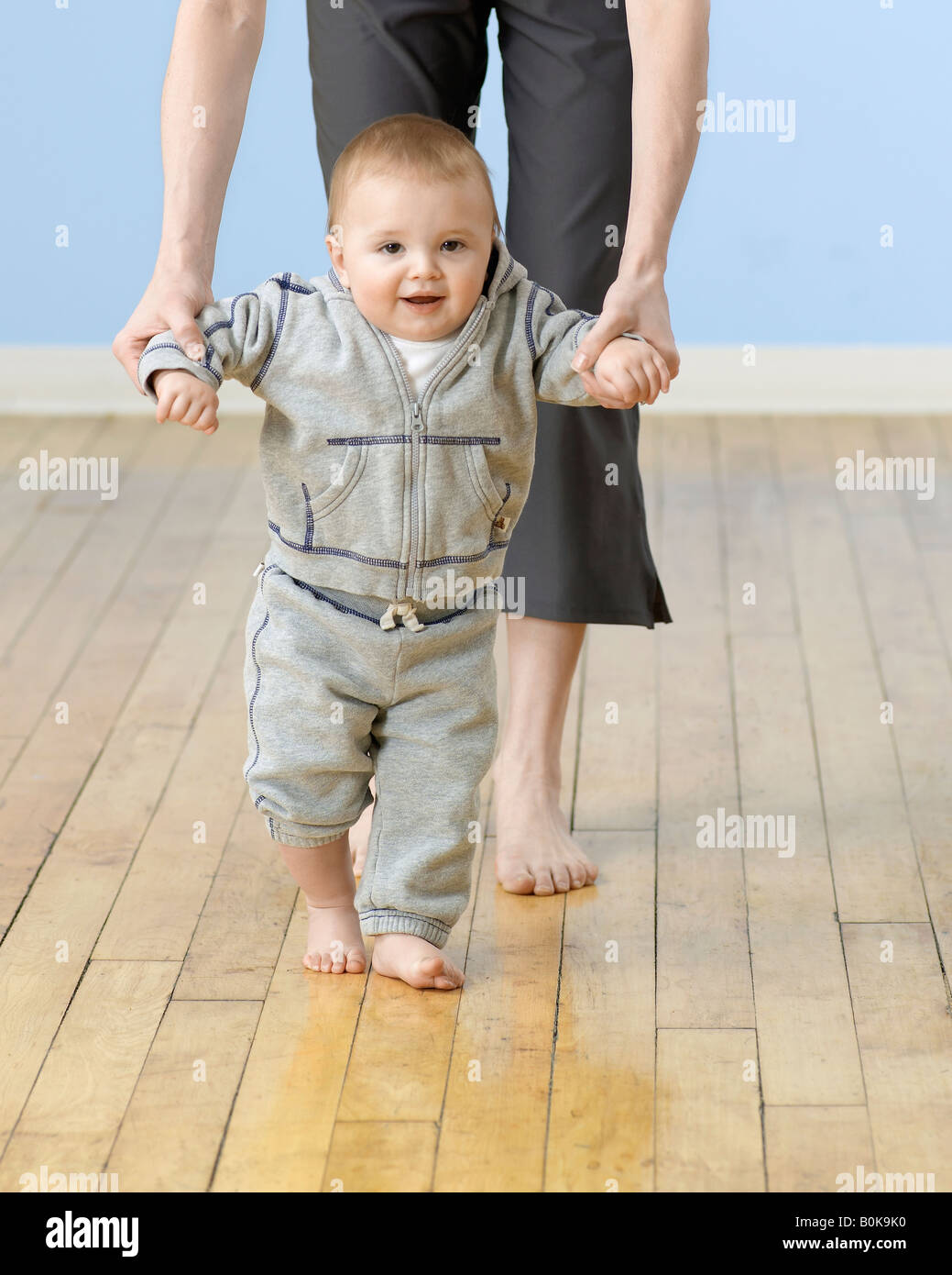 Baby Boy Learning to Walk Stock Photo - Alamy