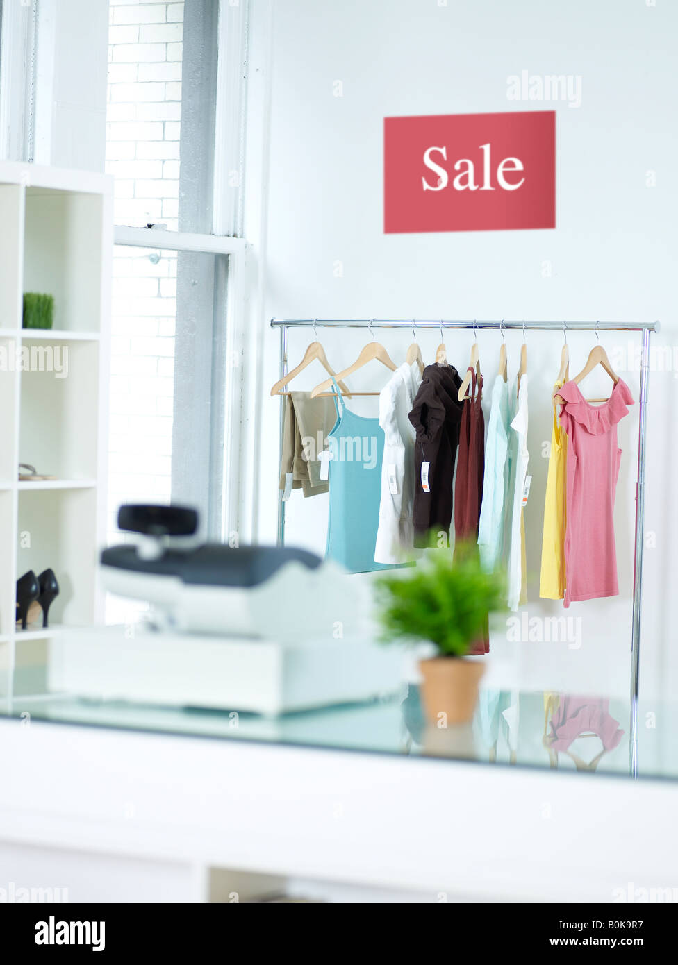 Sale Sign Above Clothes Rail Stock Photo - Alamy
