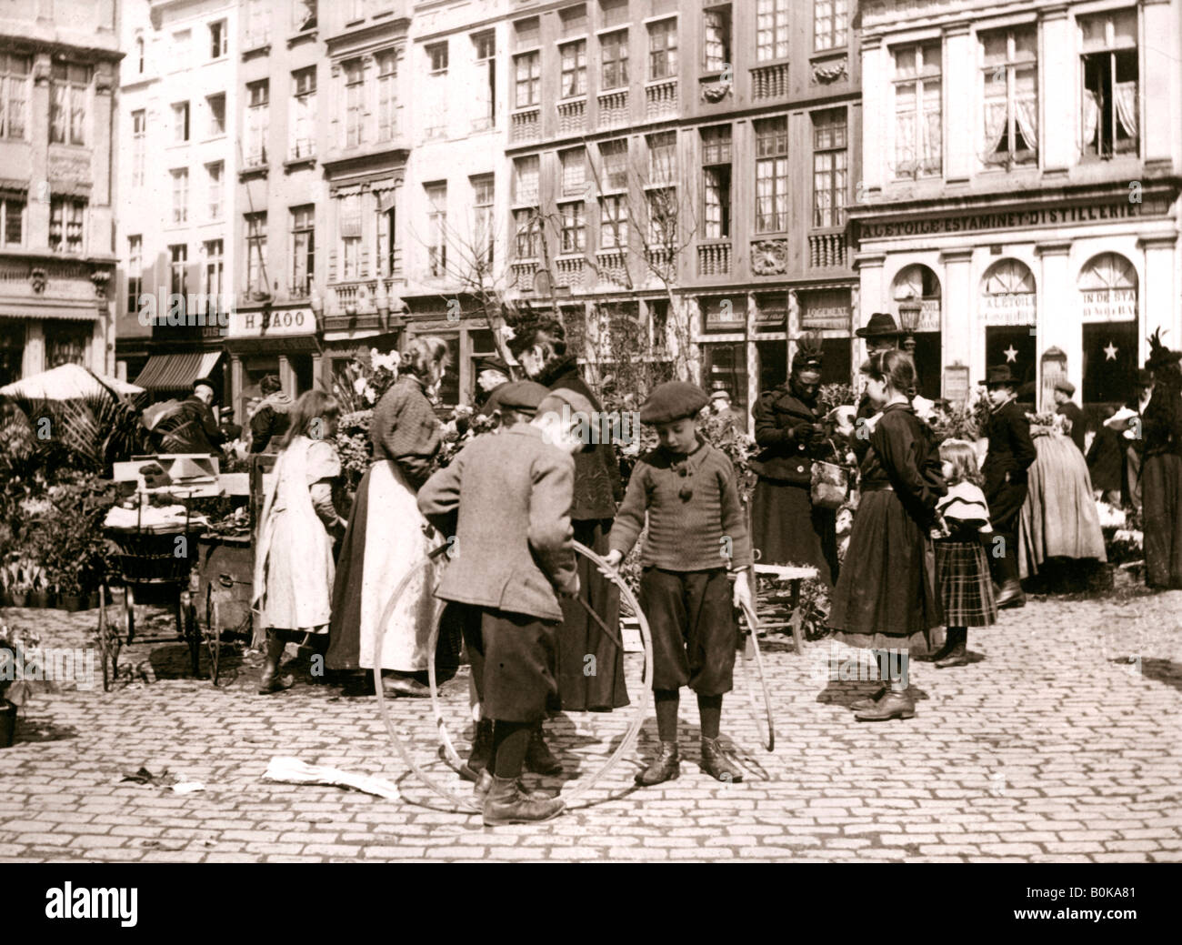 Boys with hoops at a market, Rotterdam, 1898.Artist: James Batkin Stock ...