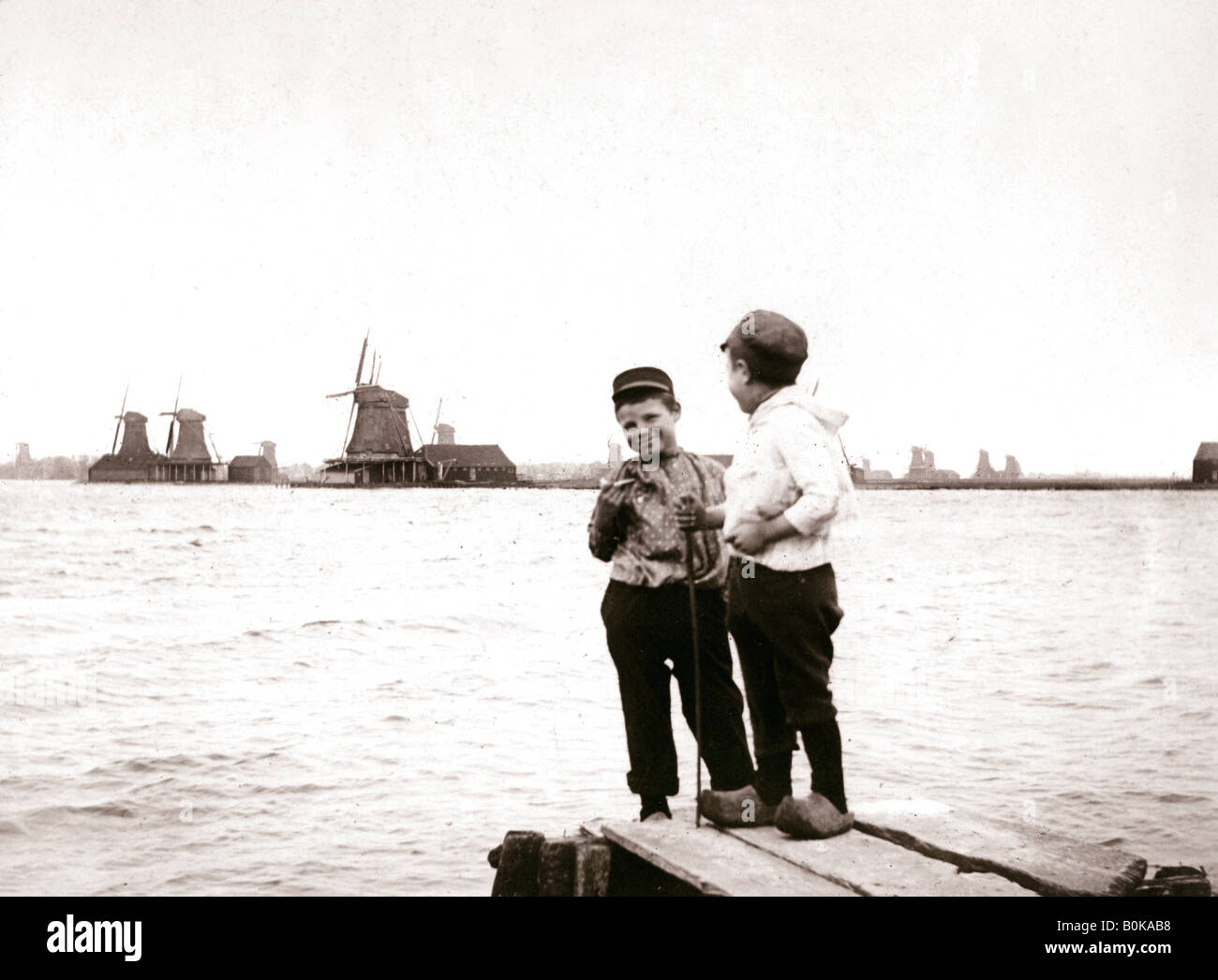 Boys by a canal, Laandam, Netherlands, 1898.Artist: James Batkin Stock ...