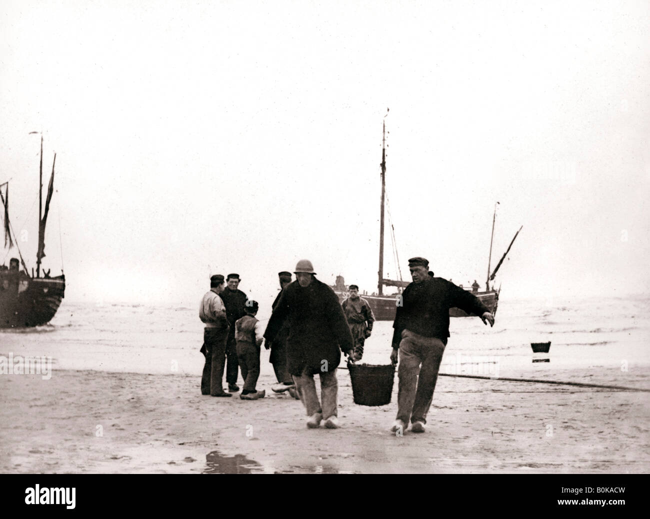 Men on the shore, Scheveningen, Netherlands, 1898.Artist: James Batkin ...