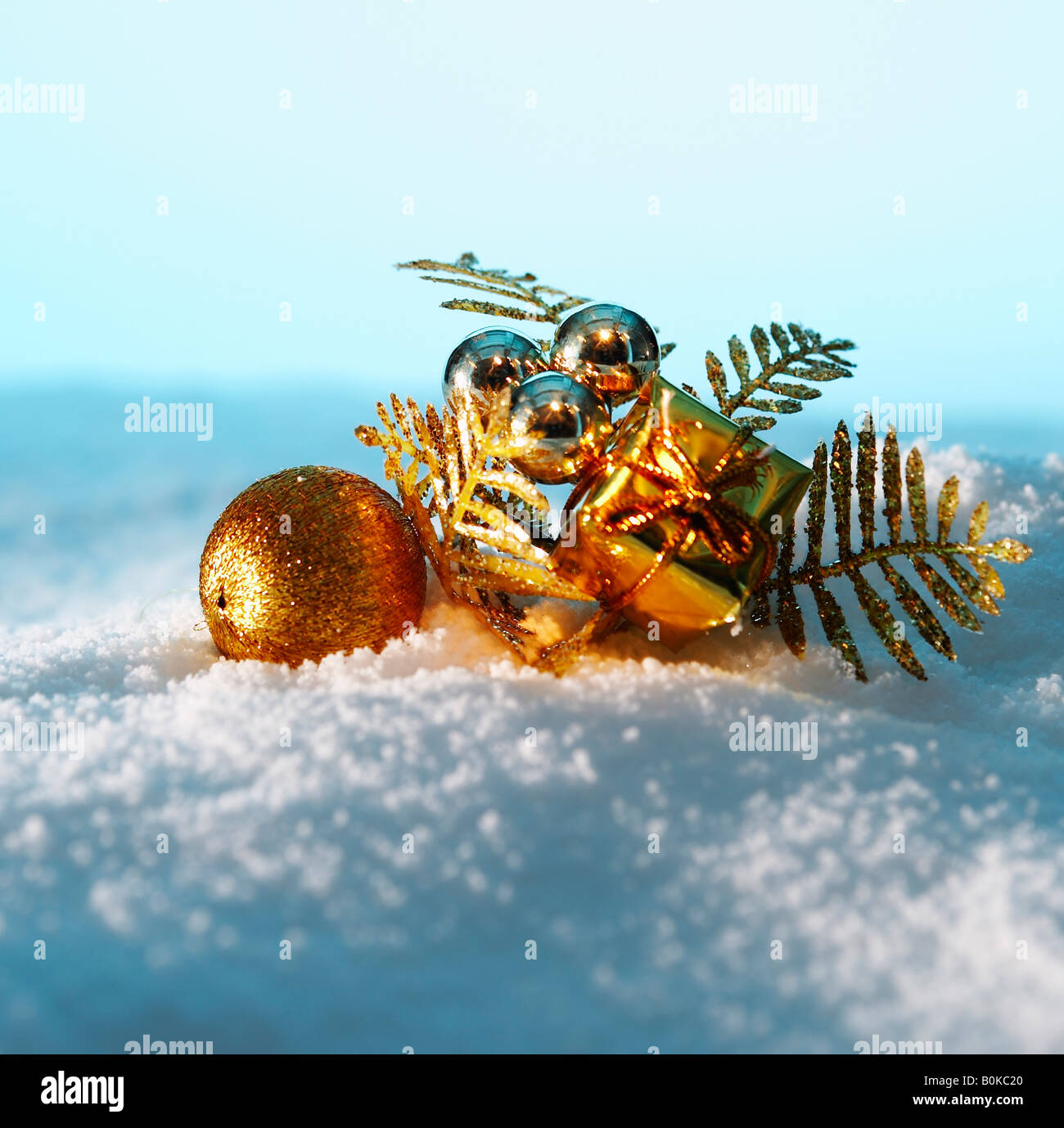 Christmas Decorations in Snow Stock Photo - Alamy