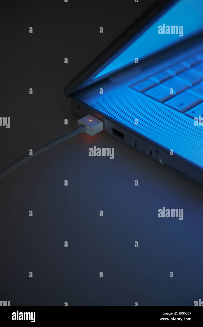 Powerlead Attached to Laptop Stock Photo - Alamy