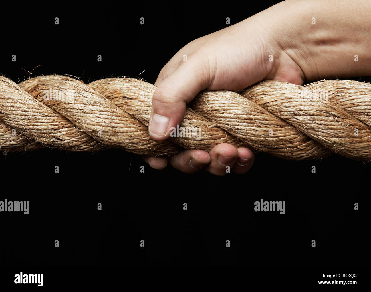 Person's Hand Holding Rope Stock Photo - Alamy