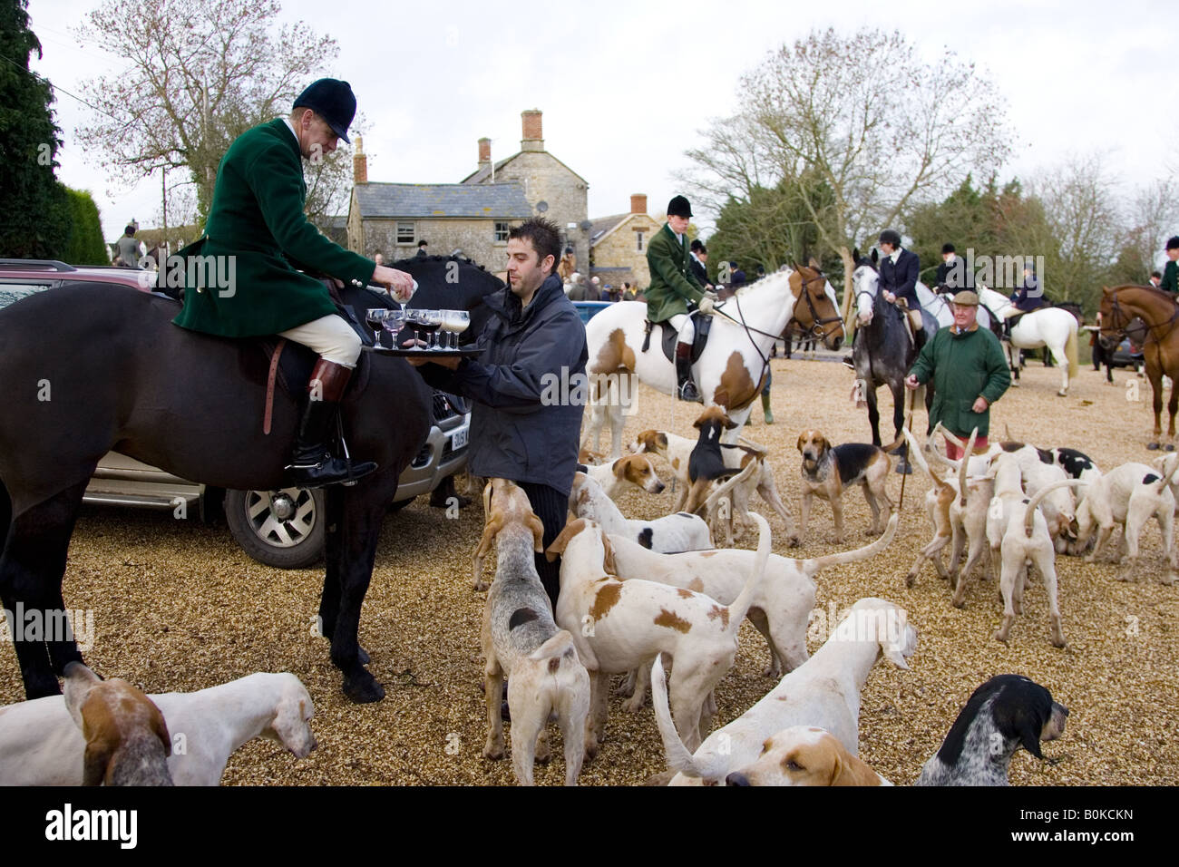 Members of Heythrop Hunt are offered traditional stirrup cup drinks at ...