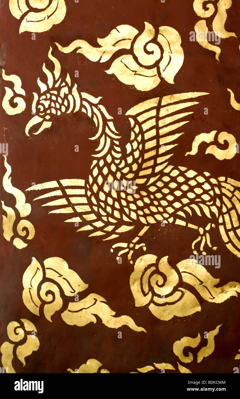 a graphic, gold stenciled artwork of an Asian Phoenix Stock Photo - Alamy