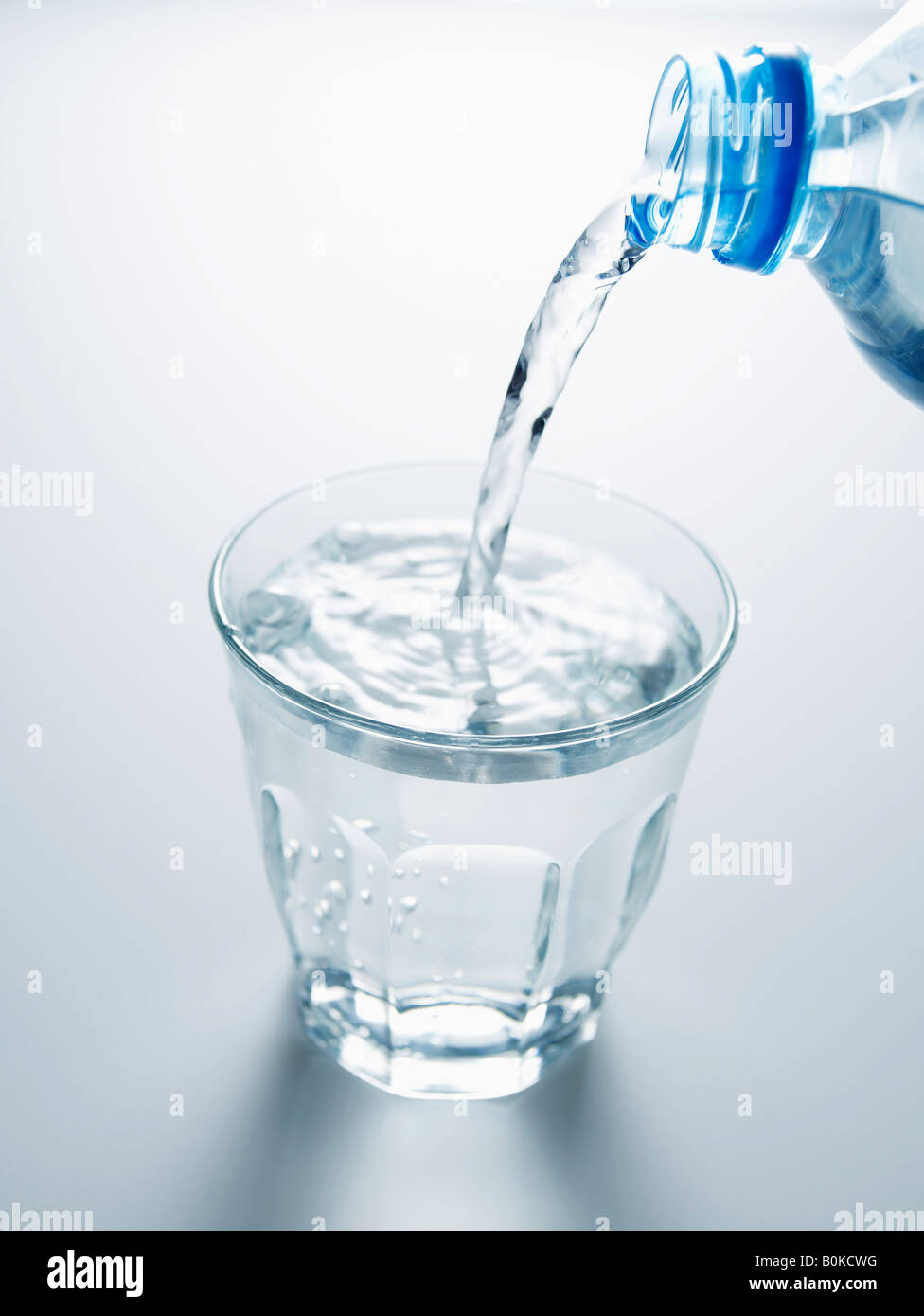 Water Pouring into Glass Stock Photo - Alamy