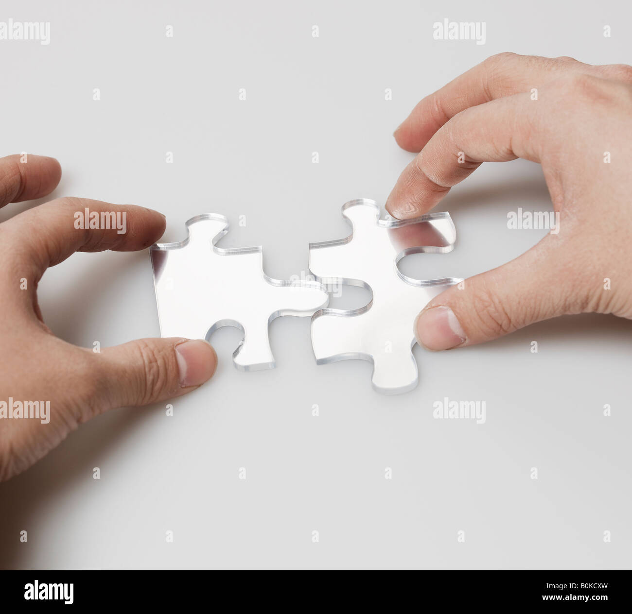 Person doing jigsaw hi-res stock photography and images - Alamy