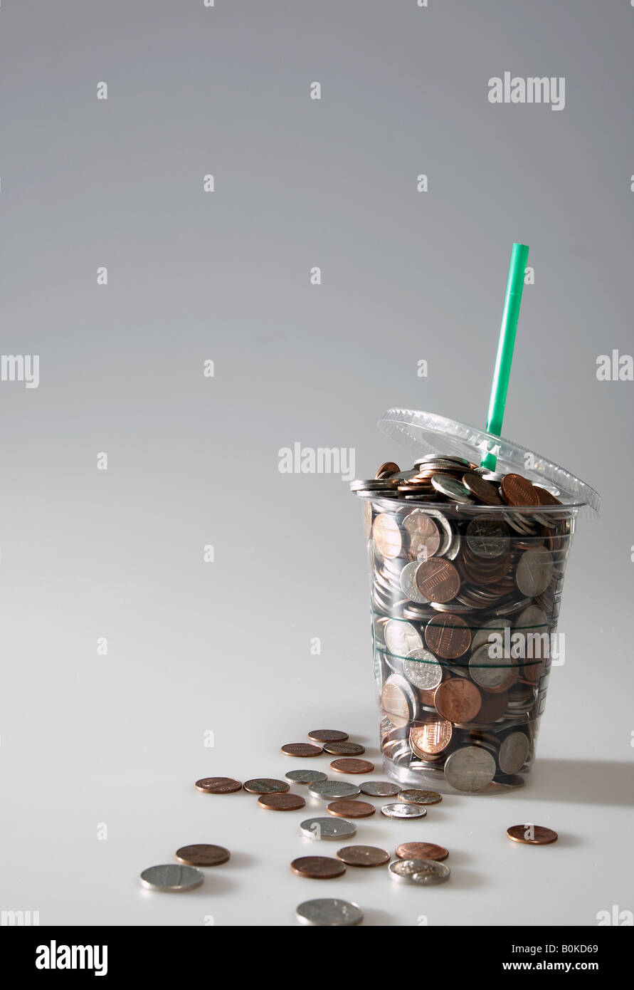 Coins Spilling from Disposable Cup Stock Photo - Alamy