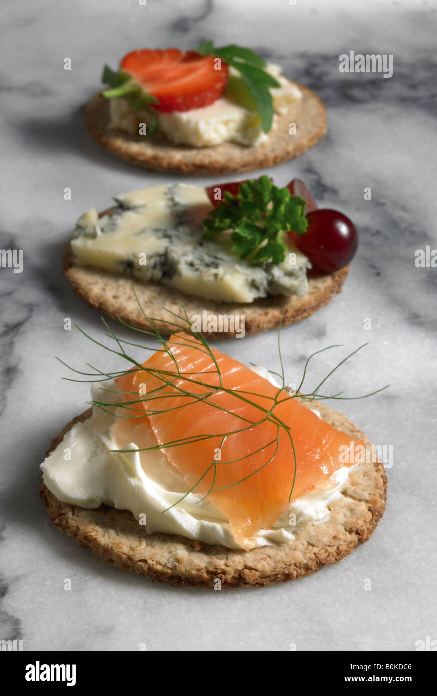 3 oatcakes with different serving suggestions. Brie & Strawberry ...