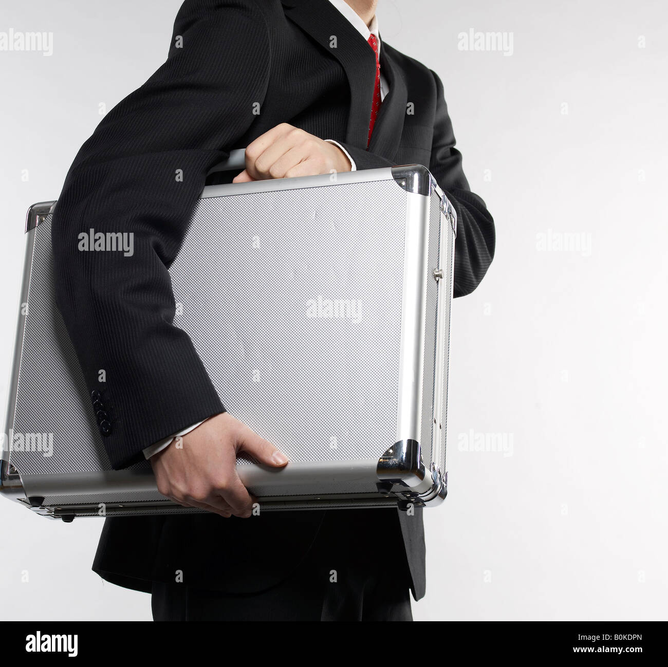 Businessman Carrying Briefcase Stock Photo - Alamy