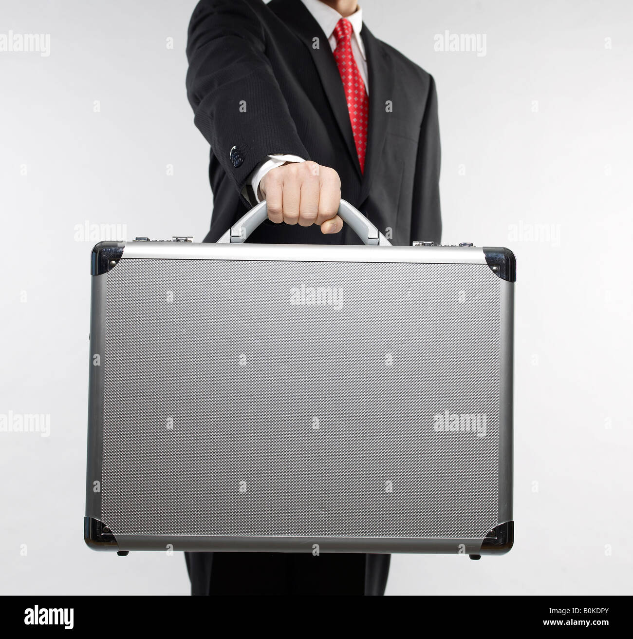Businessman Holding Briefcase Stock Photo - Alamy