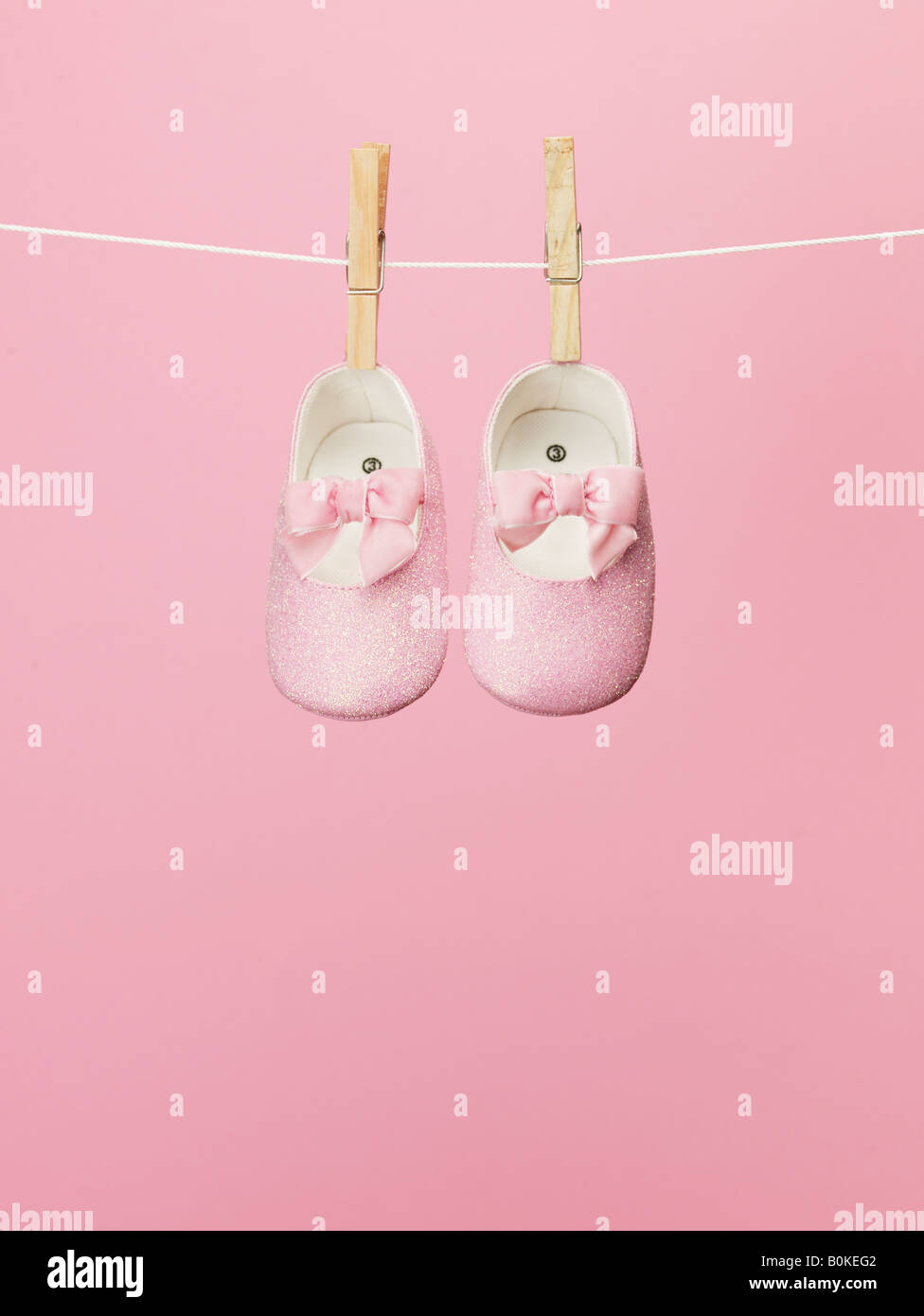 Baby Shoes on Clothes Line Stock Photo - Alamy