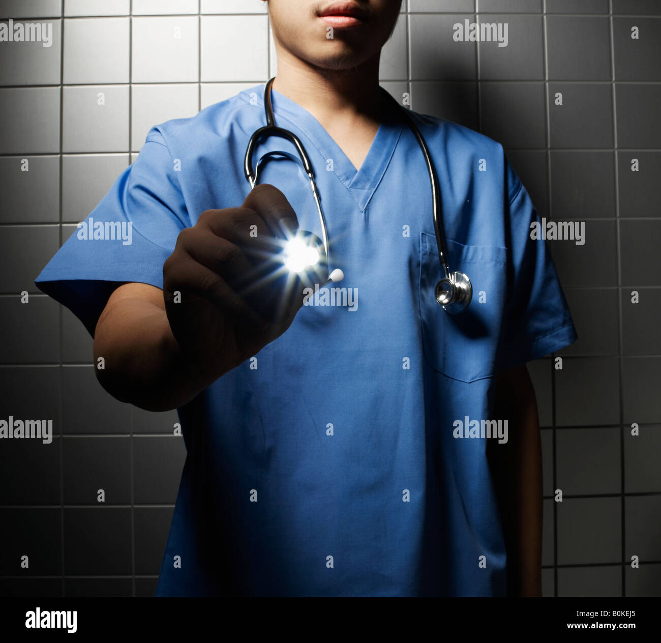 Doctor with Stethoscope and Flashlight Stock Photo - Alamy