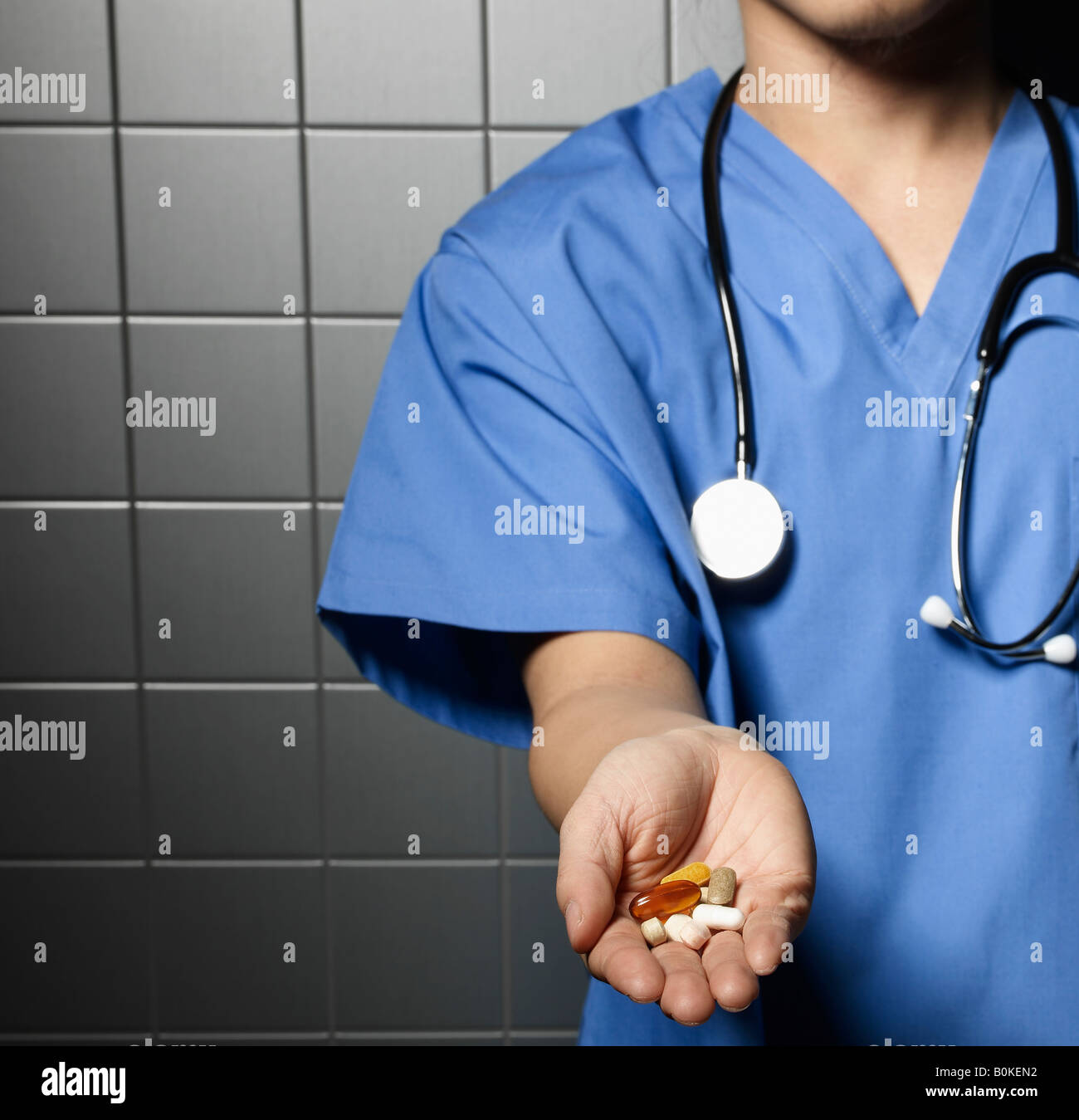 Doctor Holding Pills in Hand Stock Photo - Alamy