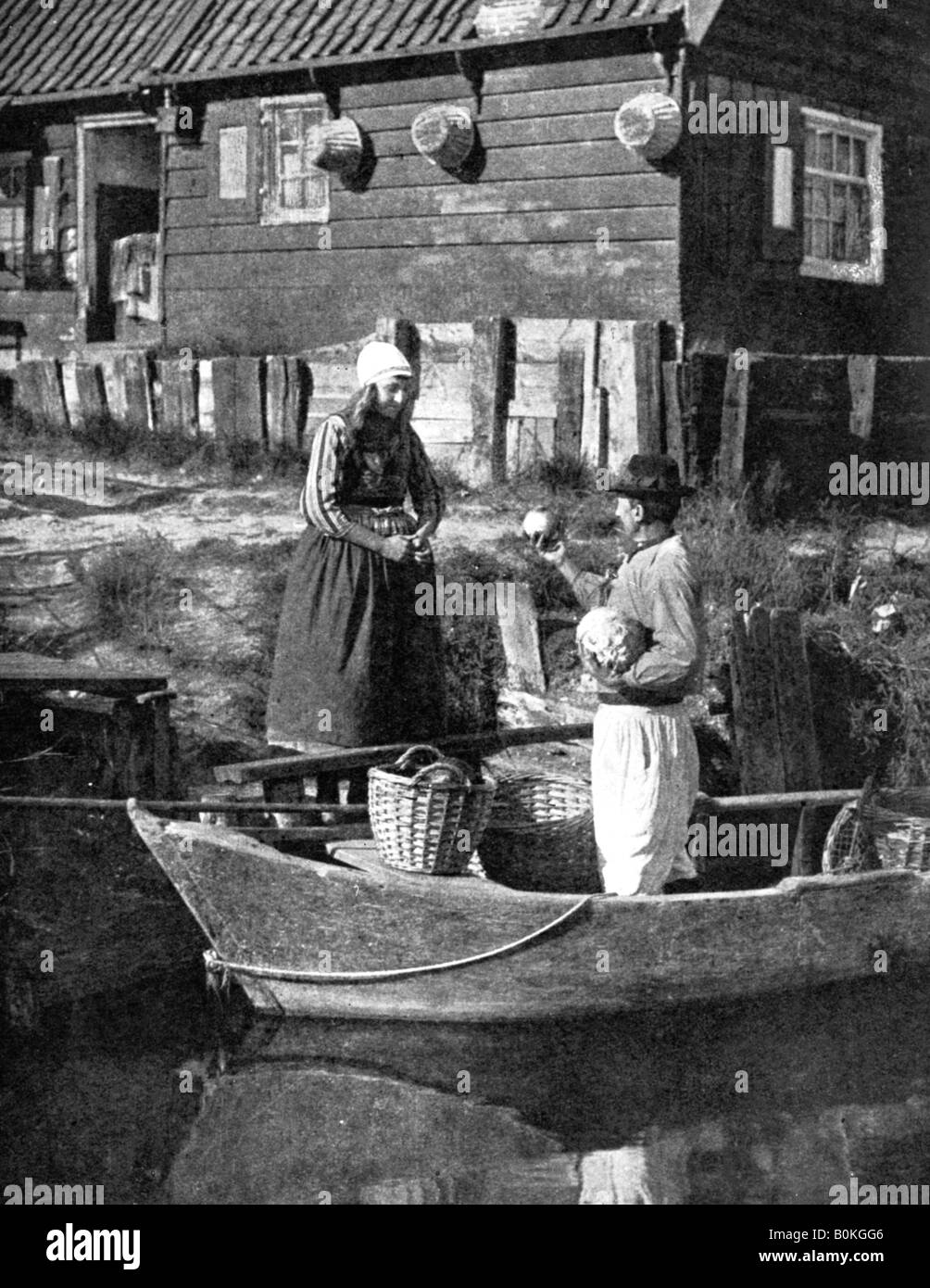 Greengrocer bringing goods by boat, Marken, Holland, 1936. Artist ...