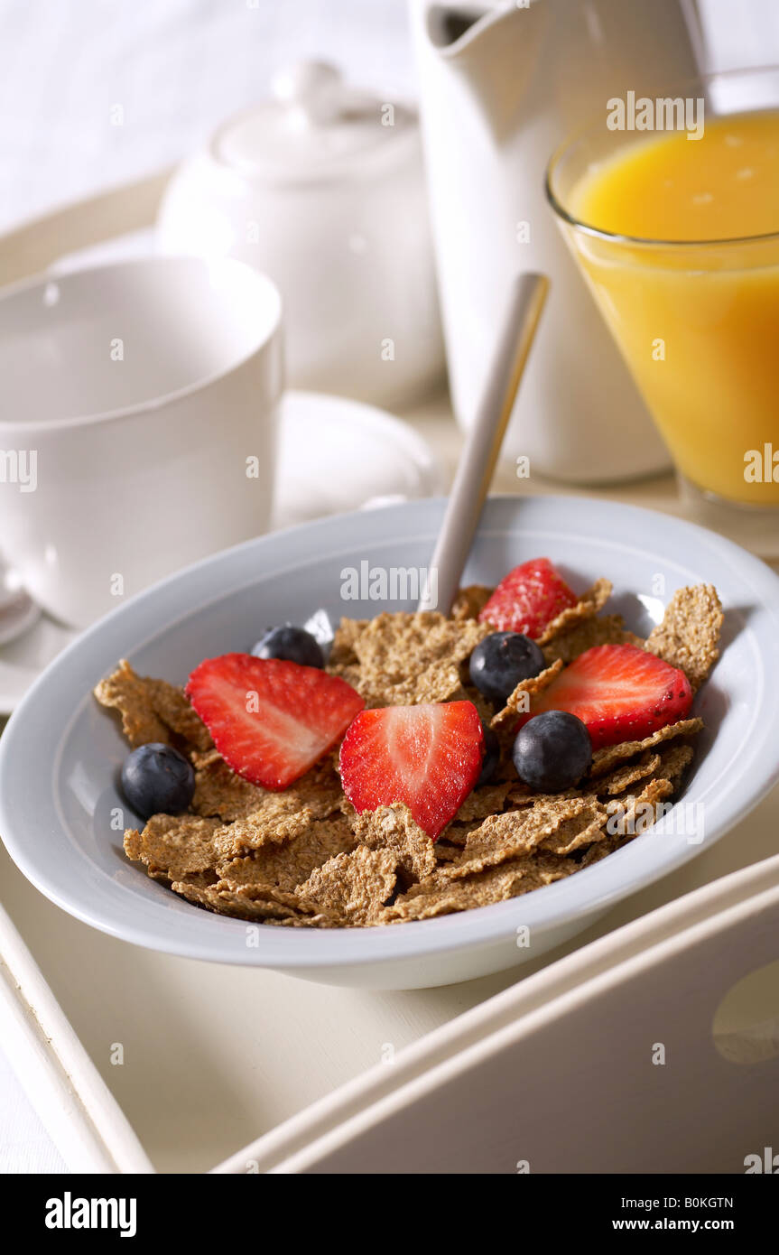 Bowl of bran cereal with fruit on breakfast tray Stock Photo - Alamy