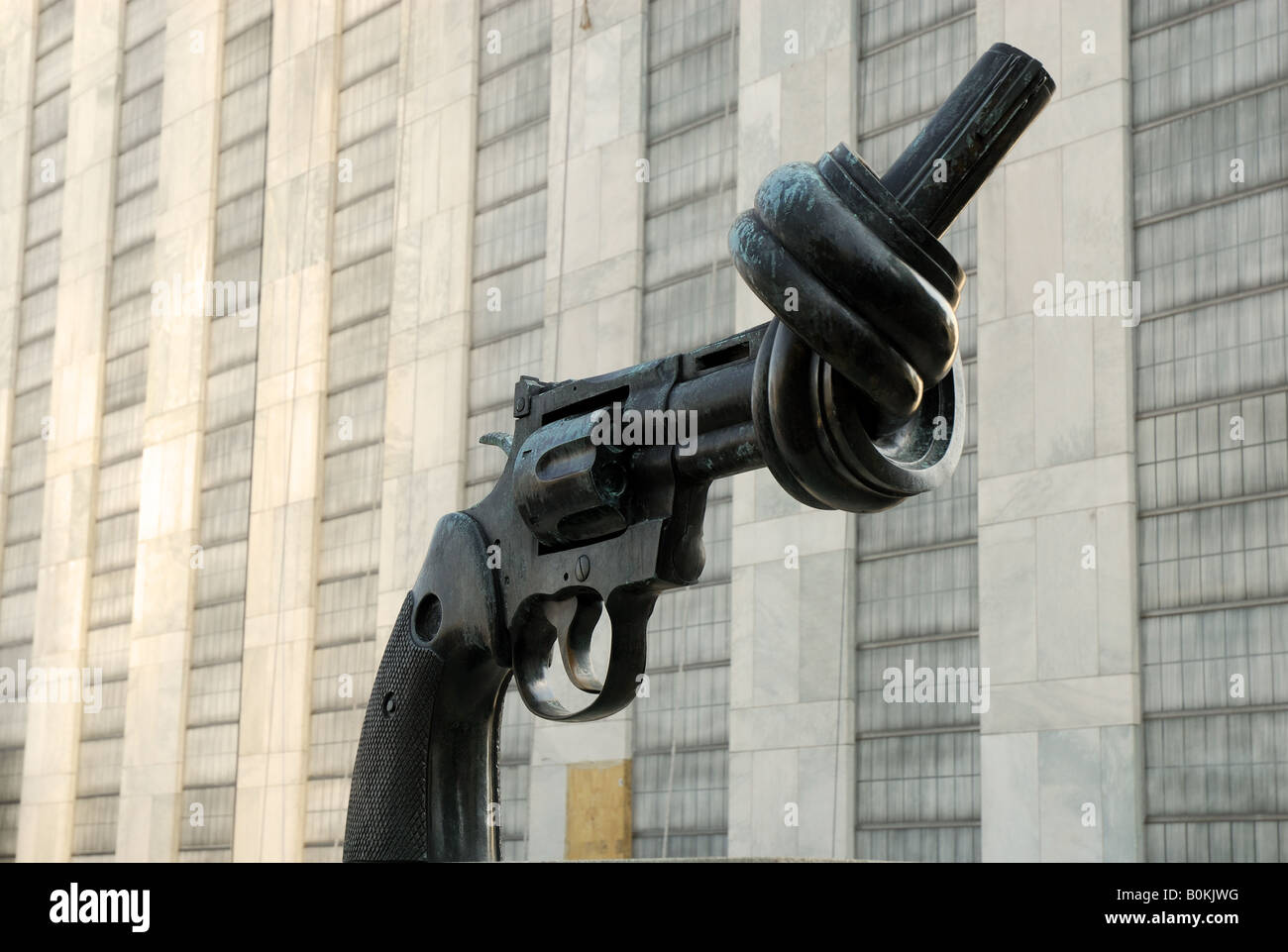 Gun tied in a knot in front of the UN headquarters, New York Stock ...