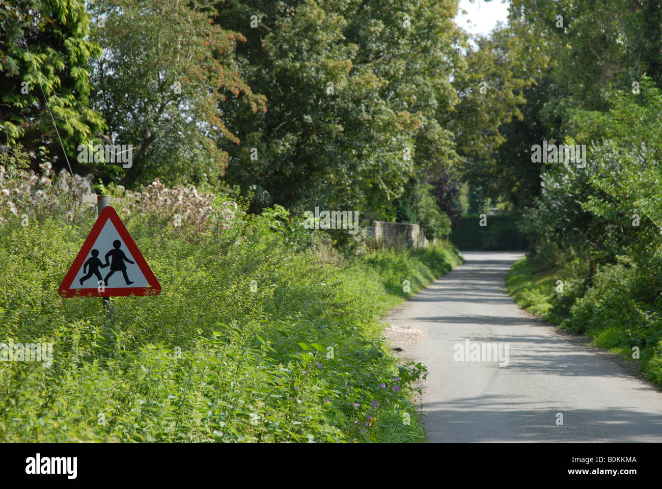 warning sign depicting children crossing road, Lavant, West Sussex ...