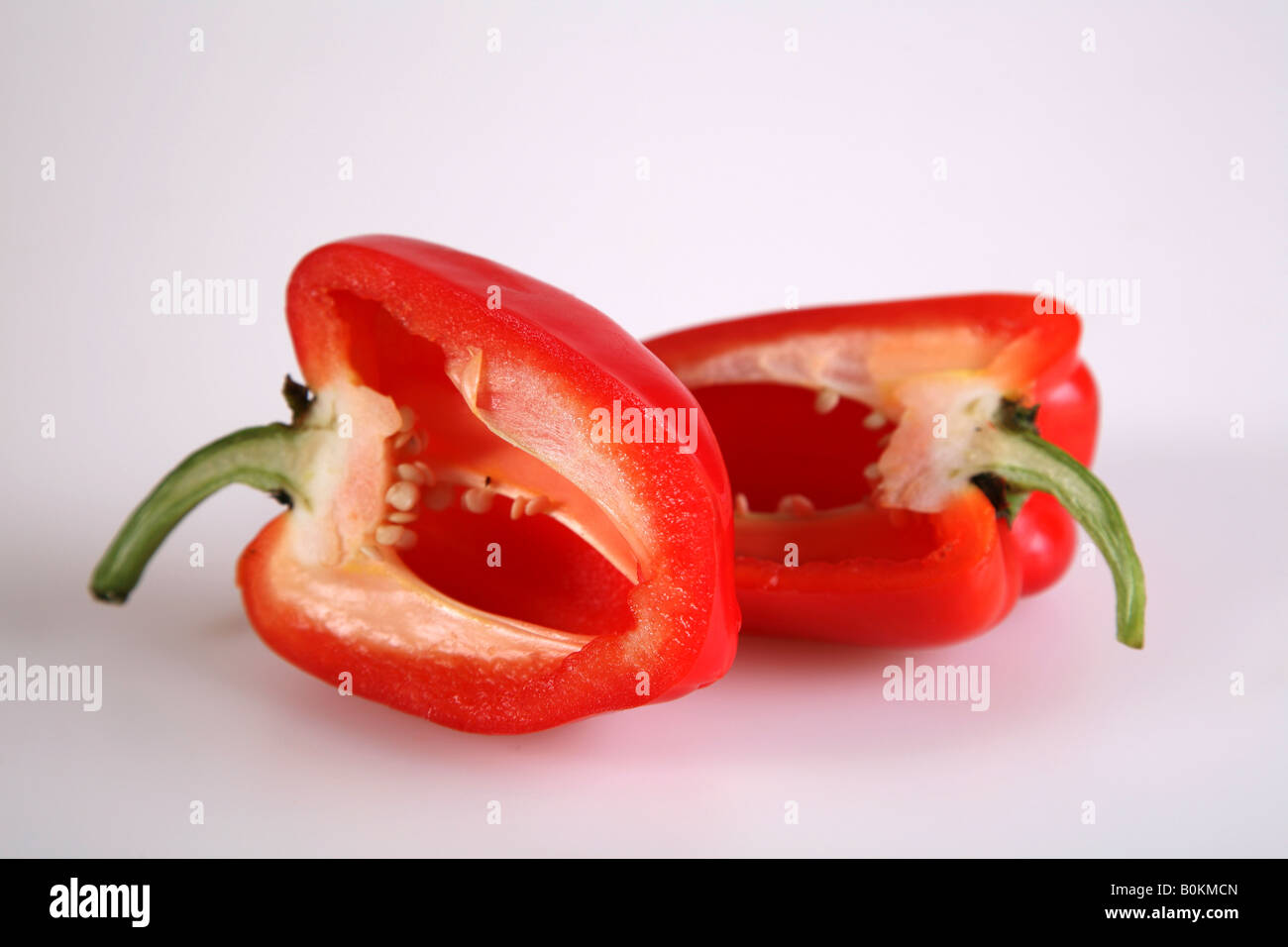 Red Bell Pepper Sliced in half Stock Photo - Alamy