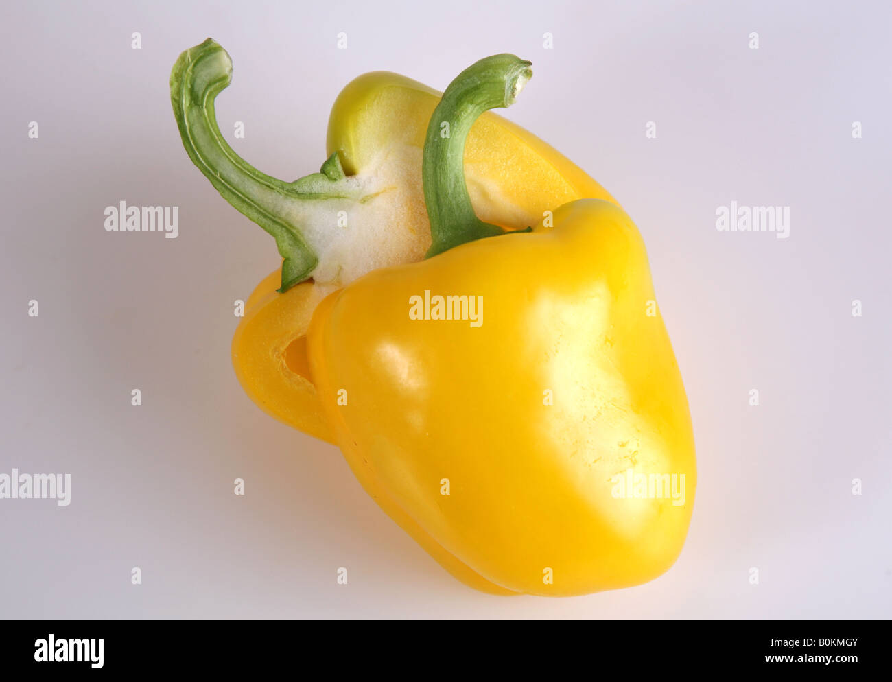 Yellow Bell Pepper Sliced in half Stock Photo - Alamy
