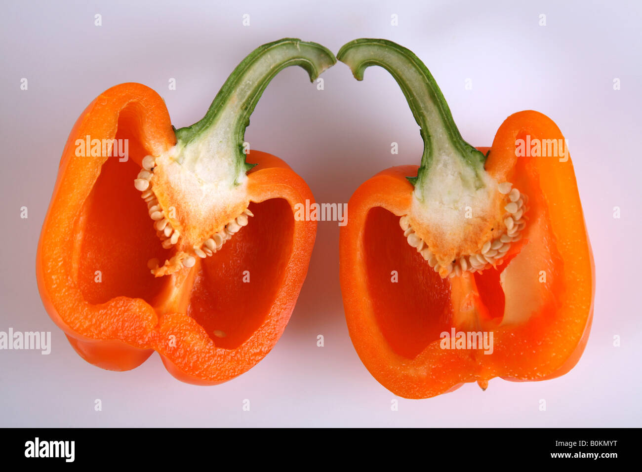 Orange Bell Pepper Sliced in half Stock Photo - Alamy