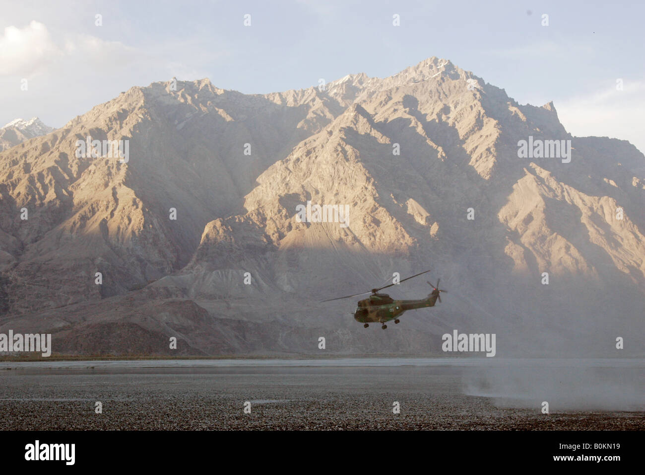 Helicopter flying through mountains hi-res stock photography and images ...