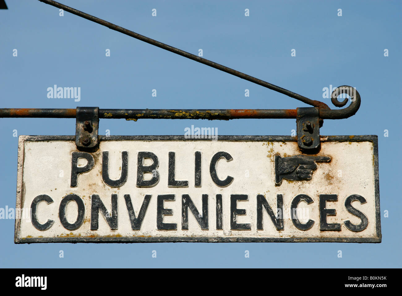 Old fashioned public convenience sign in Cotswold village in the UK ...