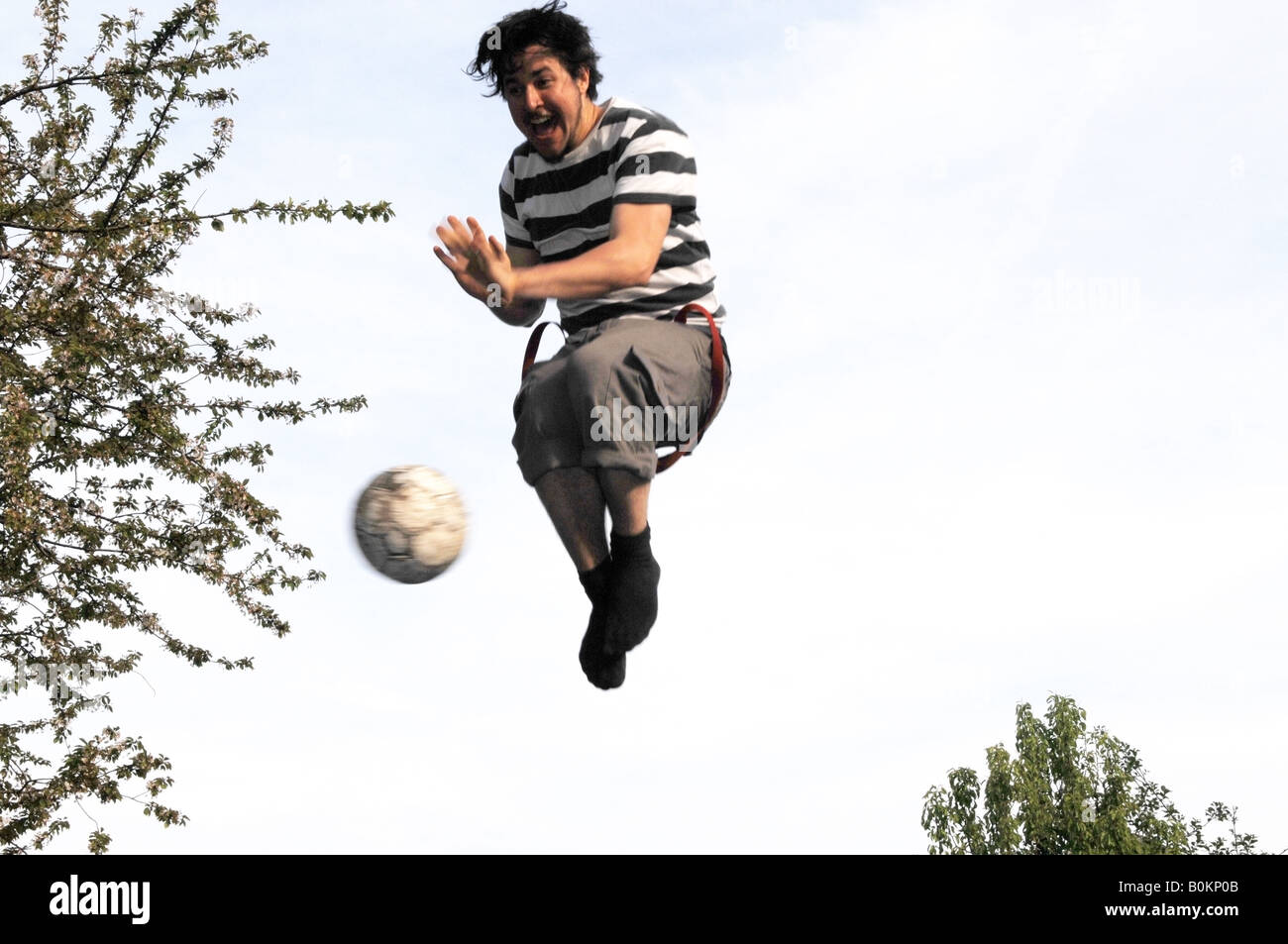 Male football jump hi-res stock photography and images - Alamy