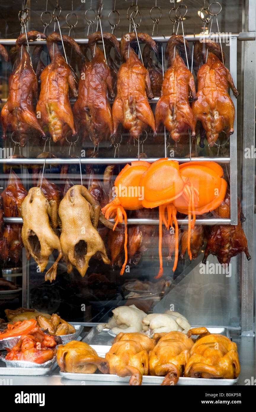Roasted fowl hanging in shop window for sale Stock Photo - Alamy