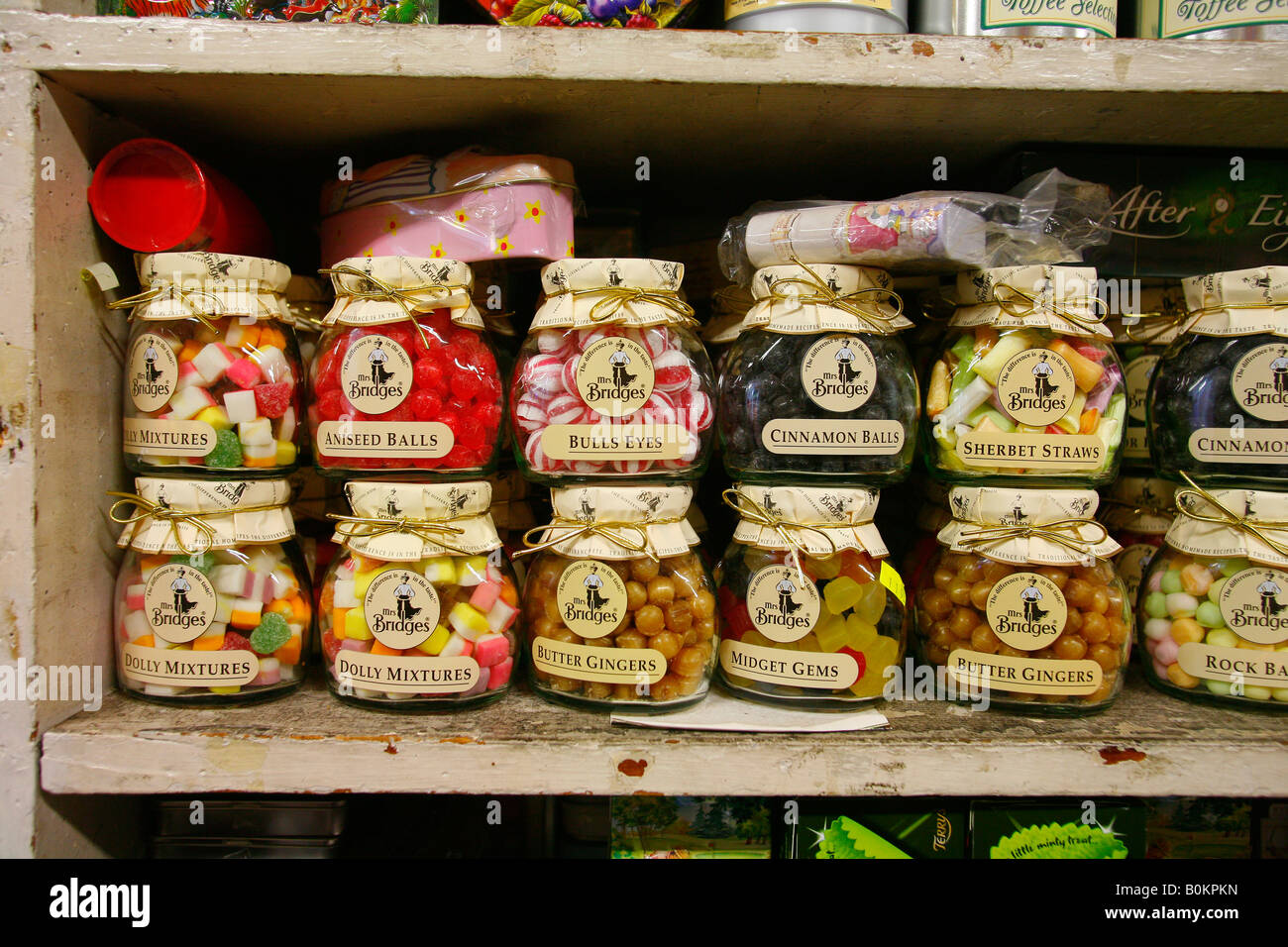 Boiled lollies and sweets in jars on the shelf of an old time grocer ...