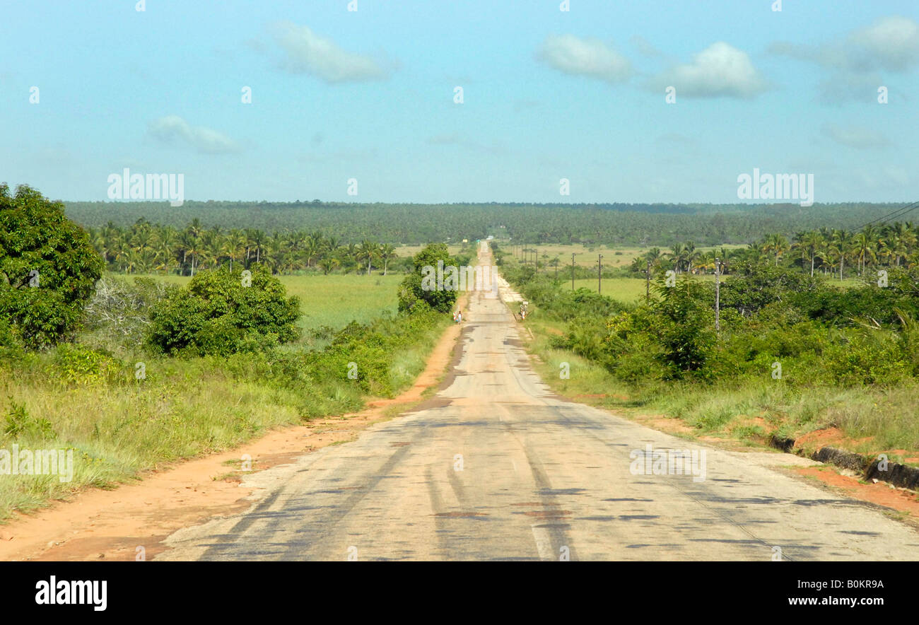 A severely potholed road in rural Mozambique Stock Photo - Alamy